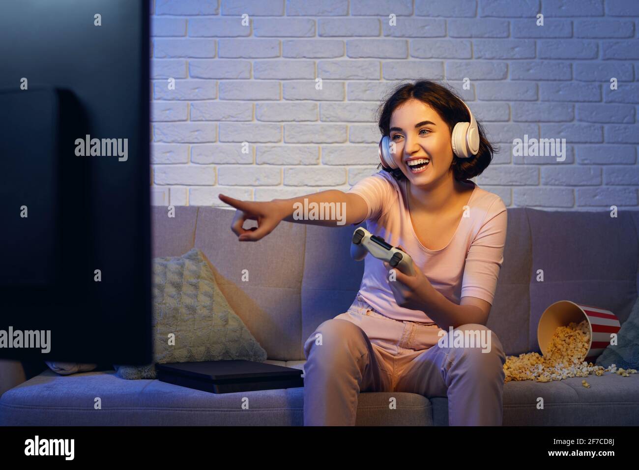 involved gamer girl playing video games on the console Stock Photo - Alamy