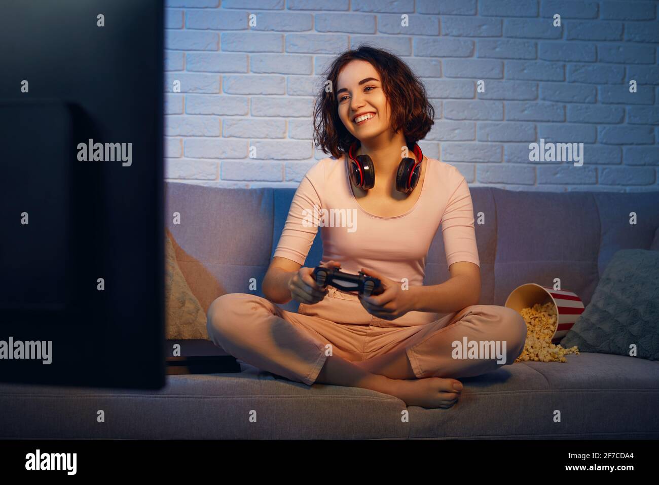 involved gamer girl playing video games on the console Stock Photo - Alamy