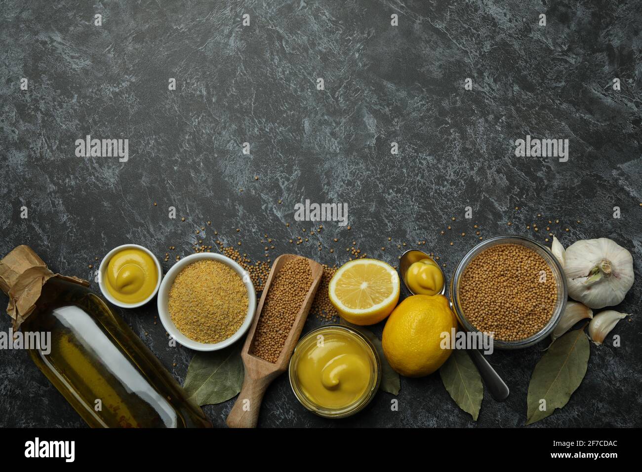 Concept of cooking mustard on black smoky background, space for text ...