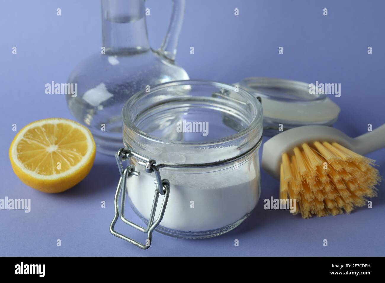 Cleaning concept with cleaning tools on violet background Stock Photo ...