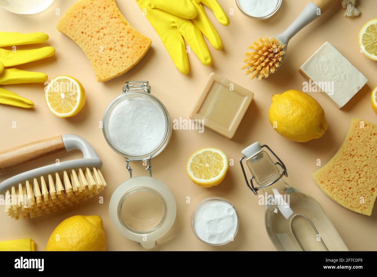 Cleaning concept with eco friendly cleaning tools and lemons on beige ...