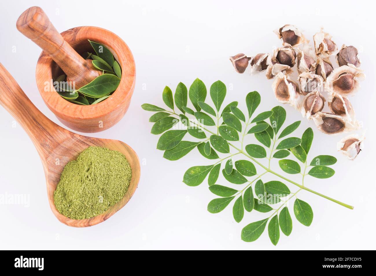 Leaves, seeds and moringa powder. Top view - Moringa oleifera Stock ...