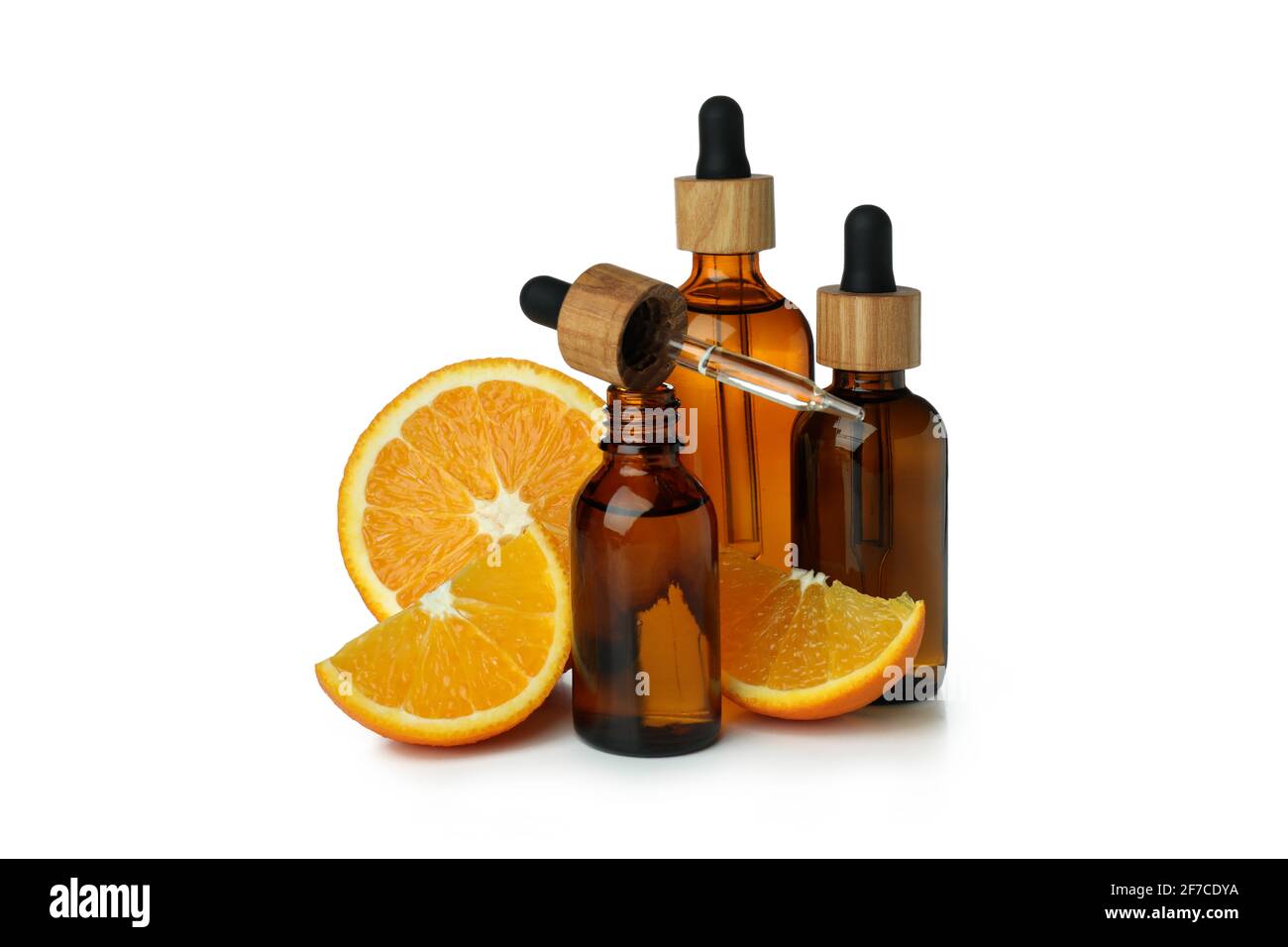 Dropper bottles with oil and orange isolated on white background Stock ...