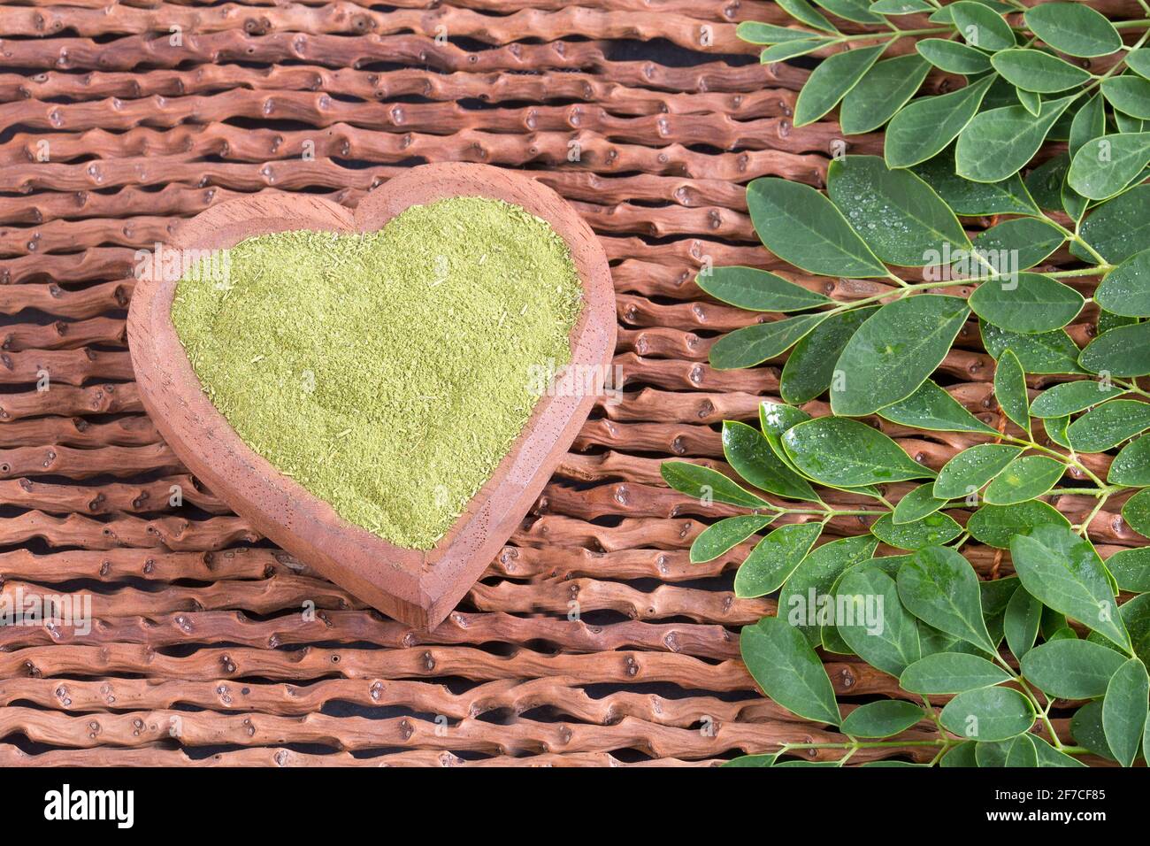 Fresh leaves and moringa powder - Moringa oleifera. Top view Stock ...