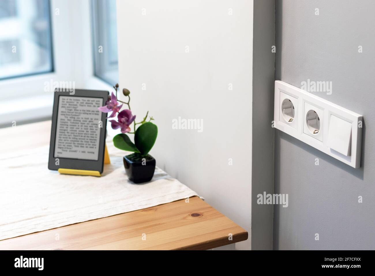 Group of white european electrical outlets and a switch located on a ...