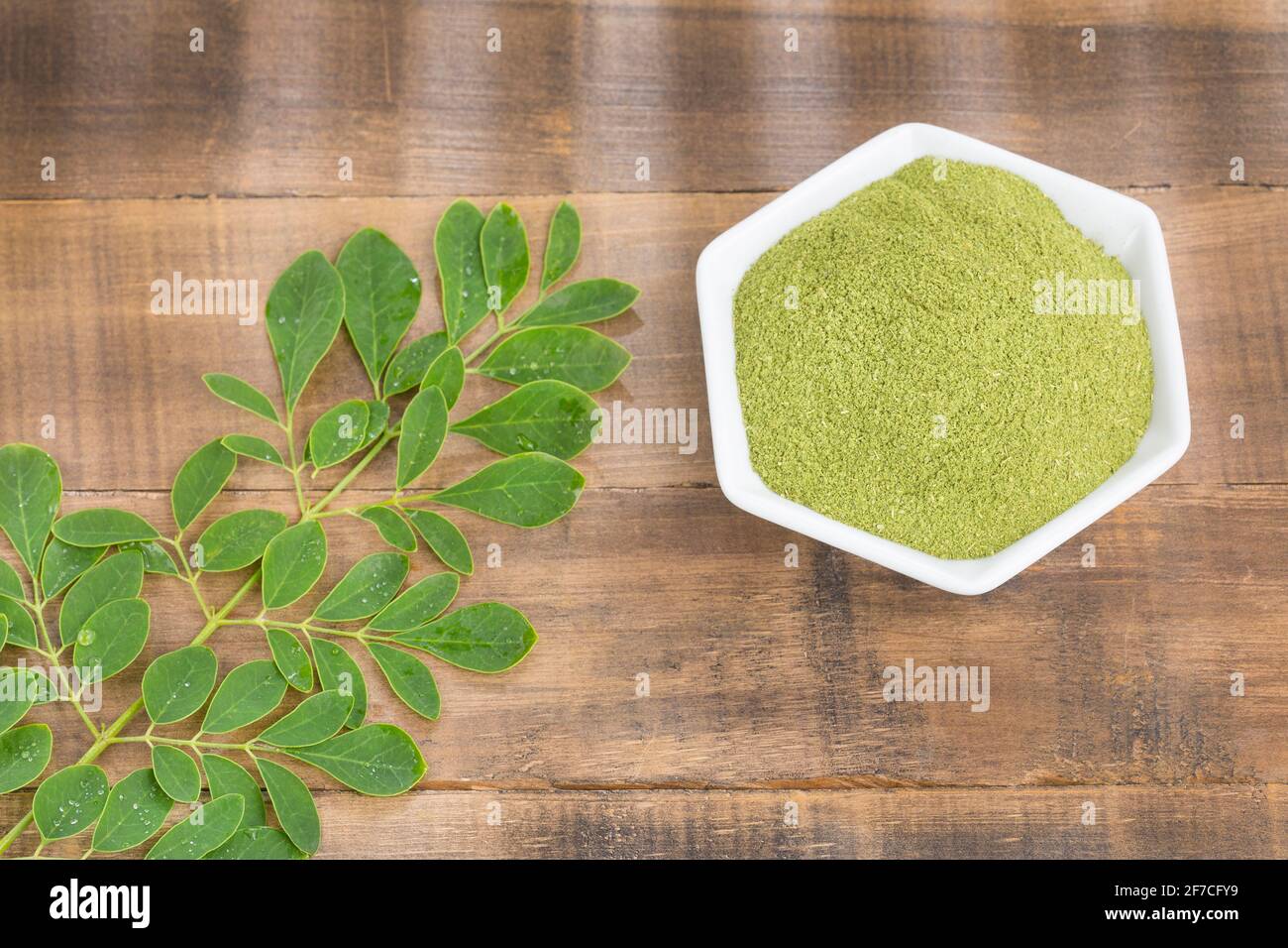 Fresh leaves and moringa powder - Moringa oleifera. Top view Stock ...