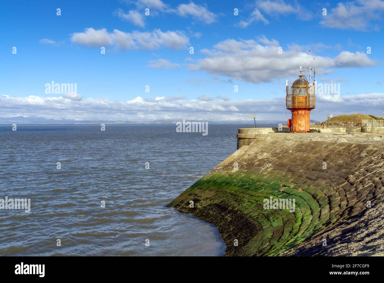 The red lighthouse at the entrance to Heysham harbour Stock Photo - Alamy