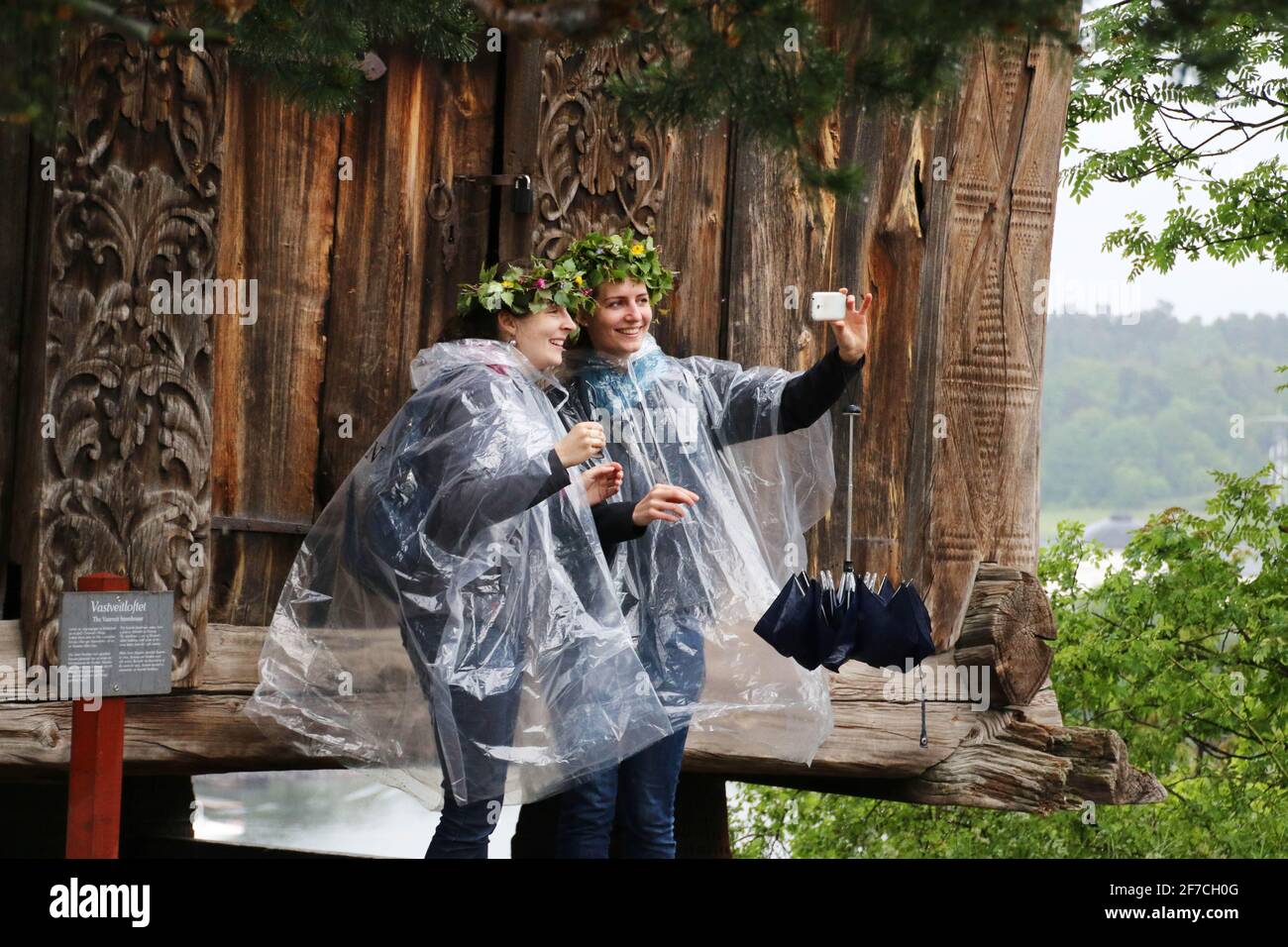 Girls taking a selfie during the midsummer celebration at Skansen ...