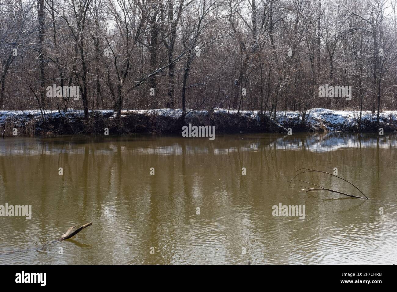 water landscape in early spring, melting snow, green water with ...