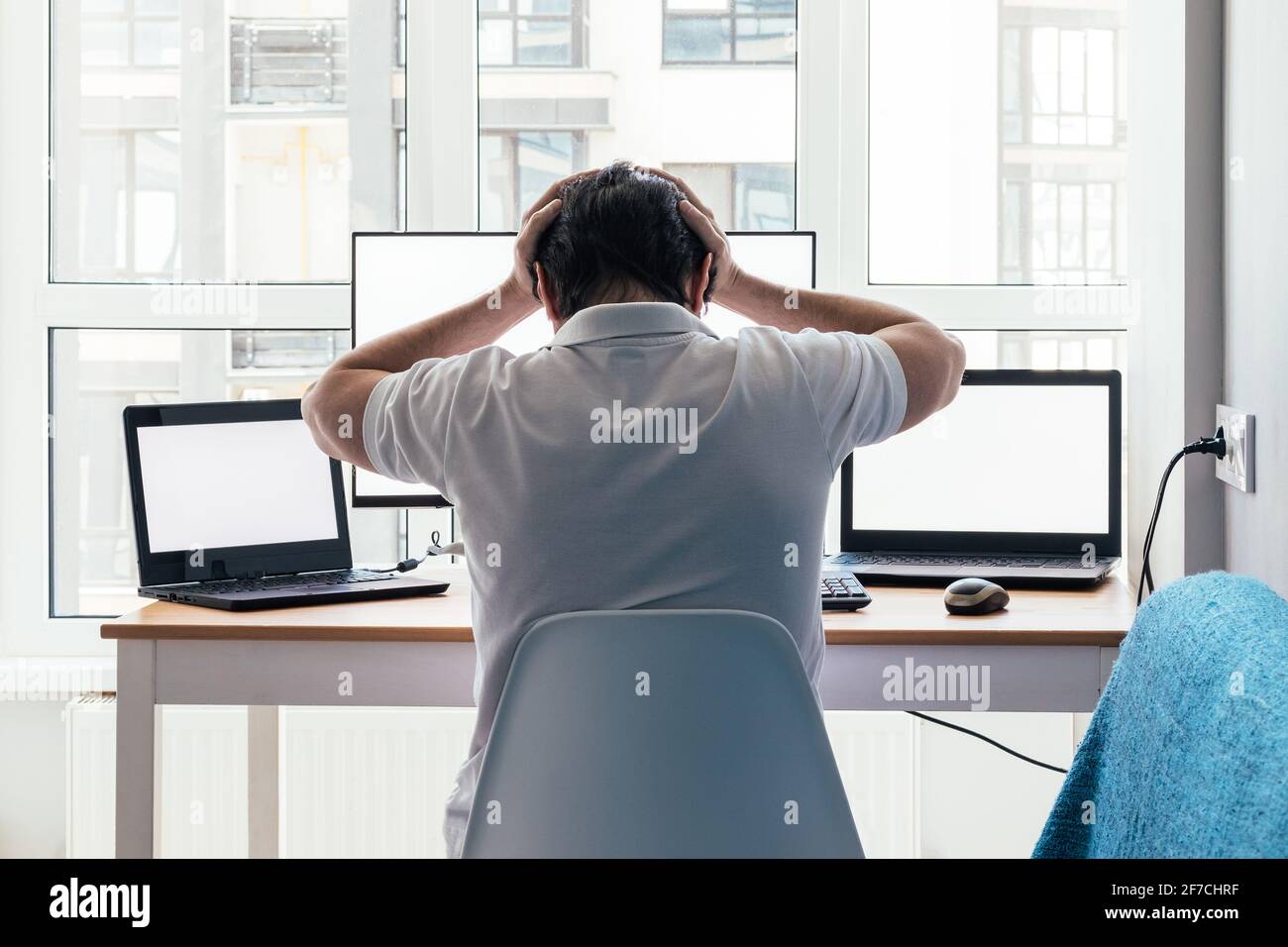 Man sitting back desk office not woman hi-res stock photography and ...