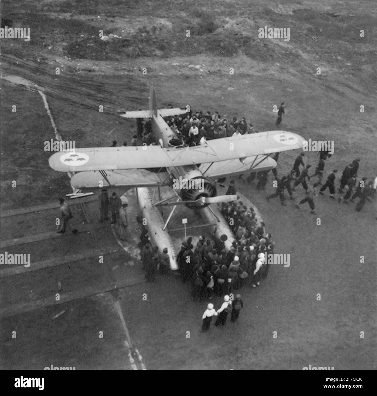 School children visiting F 2, 1939 Children gathered around aircraft S ...