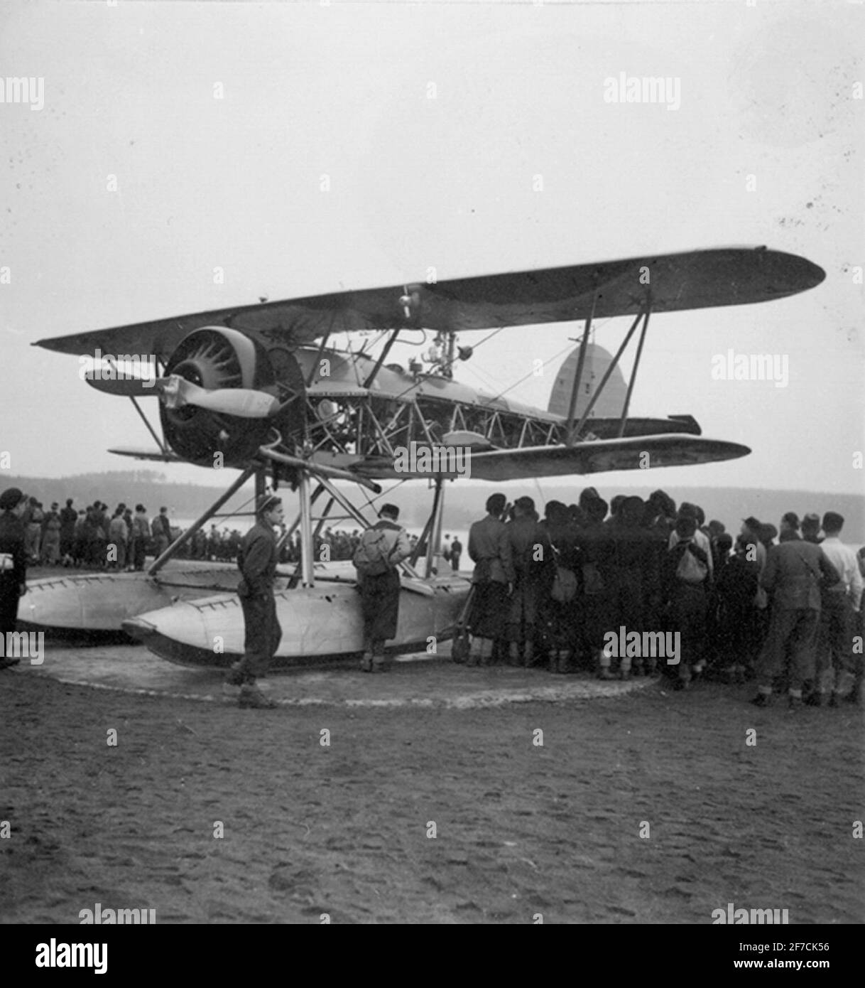 School children visiting F 2, 1939 Children gathered around aircraft S ...