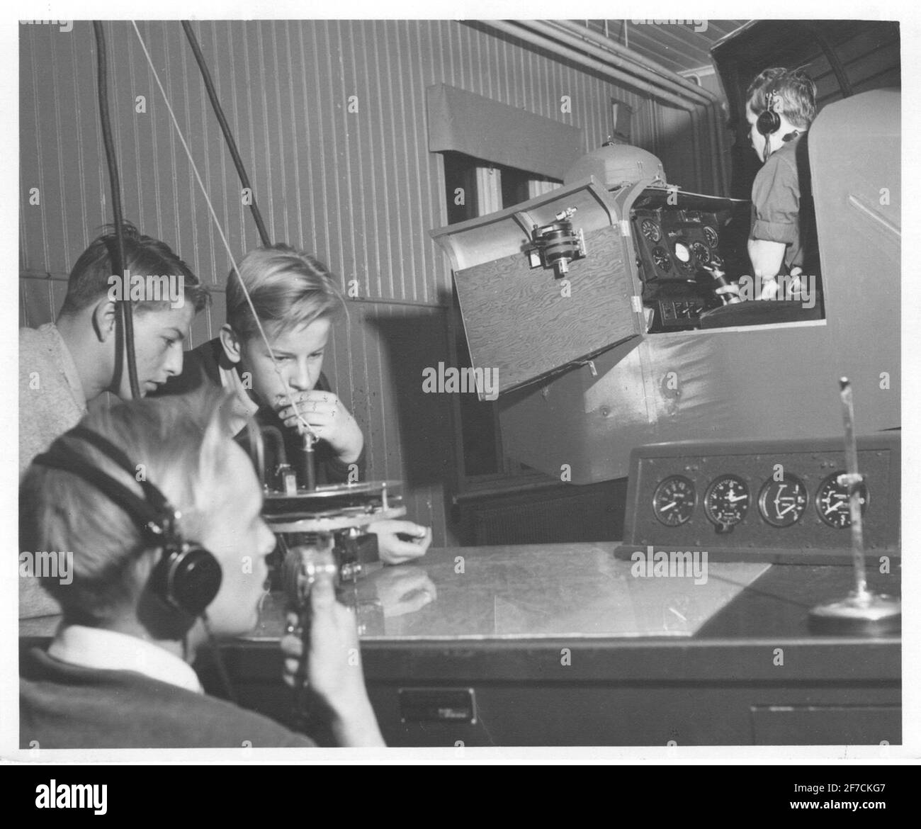 Design: Voluntary flight boys run flight simulator LinkTrainer, 1940-1950s. Design: Voluntary ...