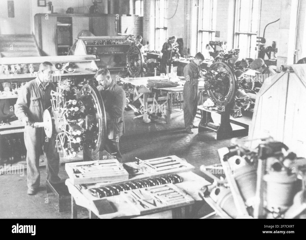 Engine workshop on CVM, 1930s . Work with engines on the engine ...