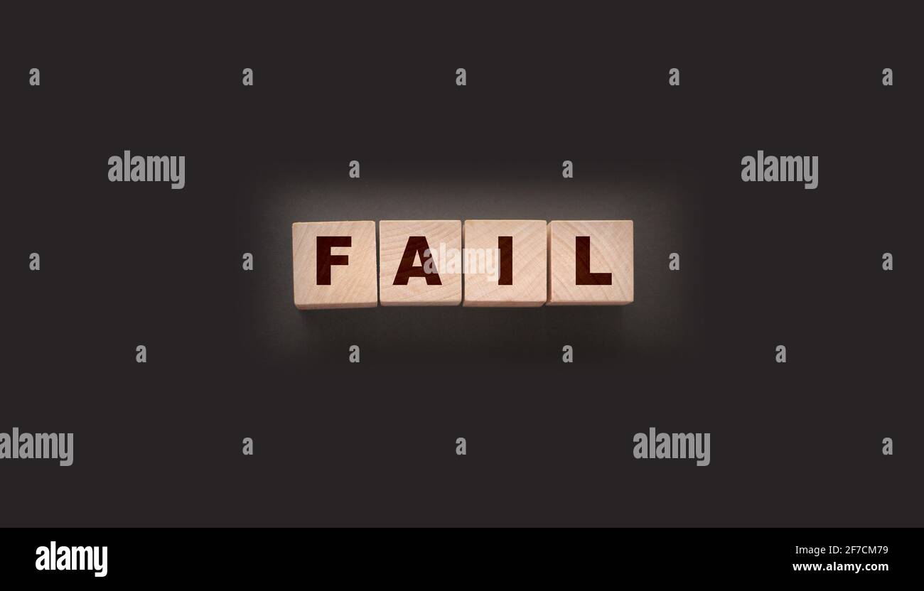 FAIL Word text Written In Wooden Cube blocks on black background ...
