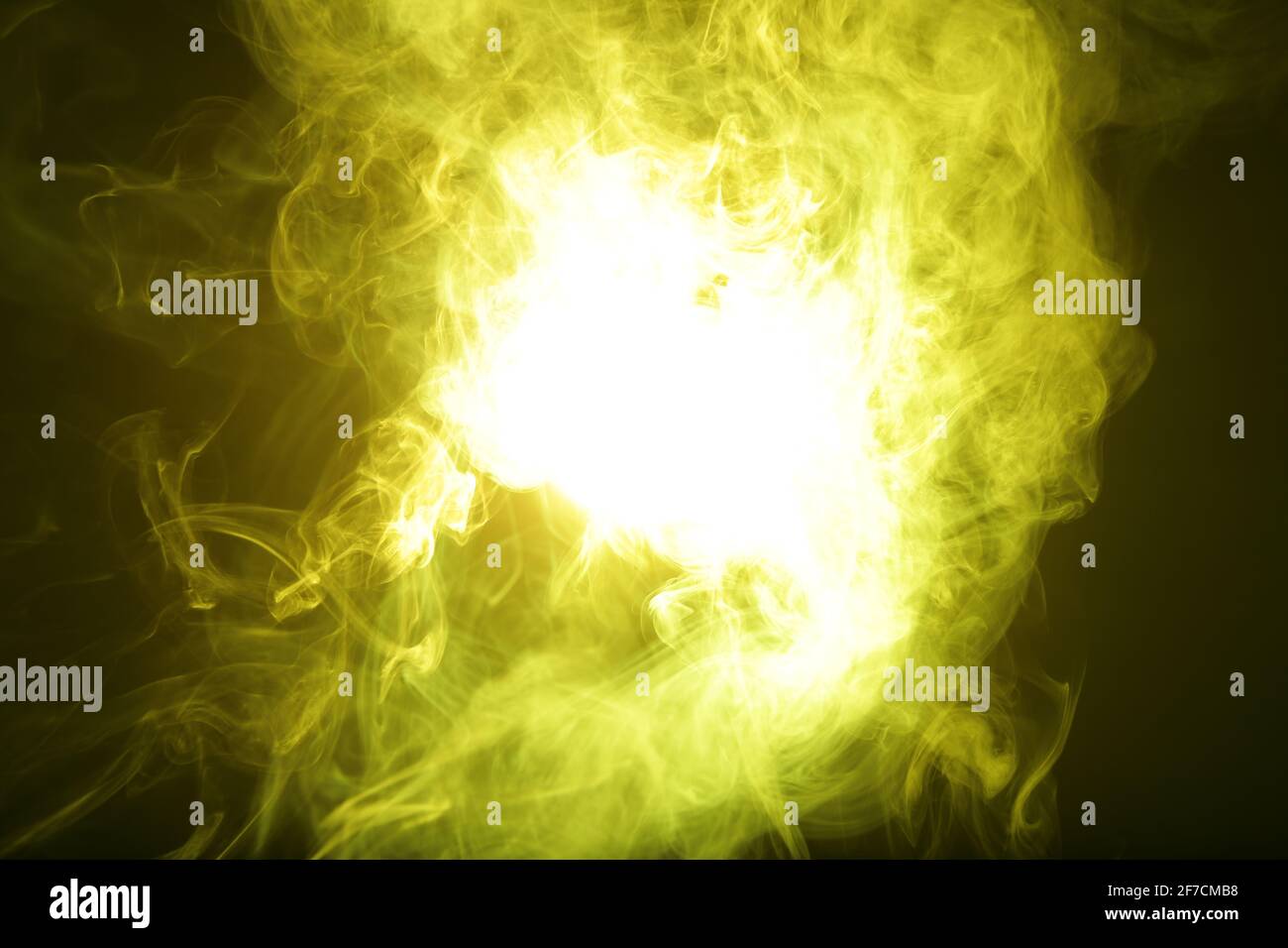 Artificial smoke is illuminated with yellow bright light Stock Photo ...
