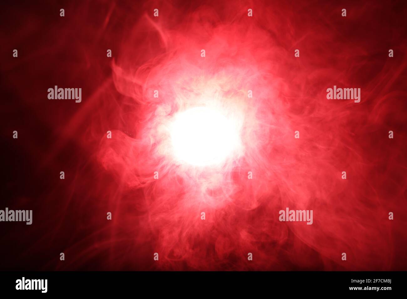 Artificial smoke is illuminated with red bright light Stock Photo - Alamy