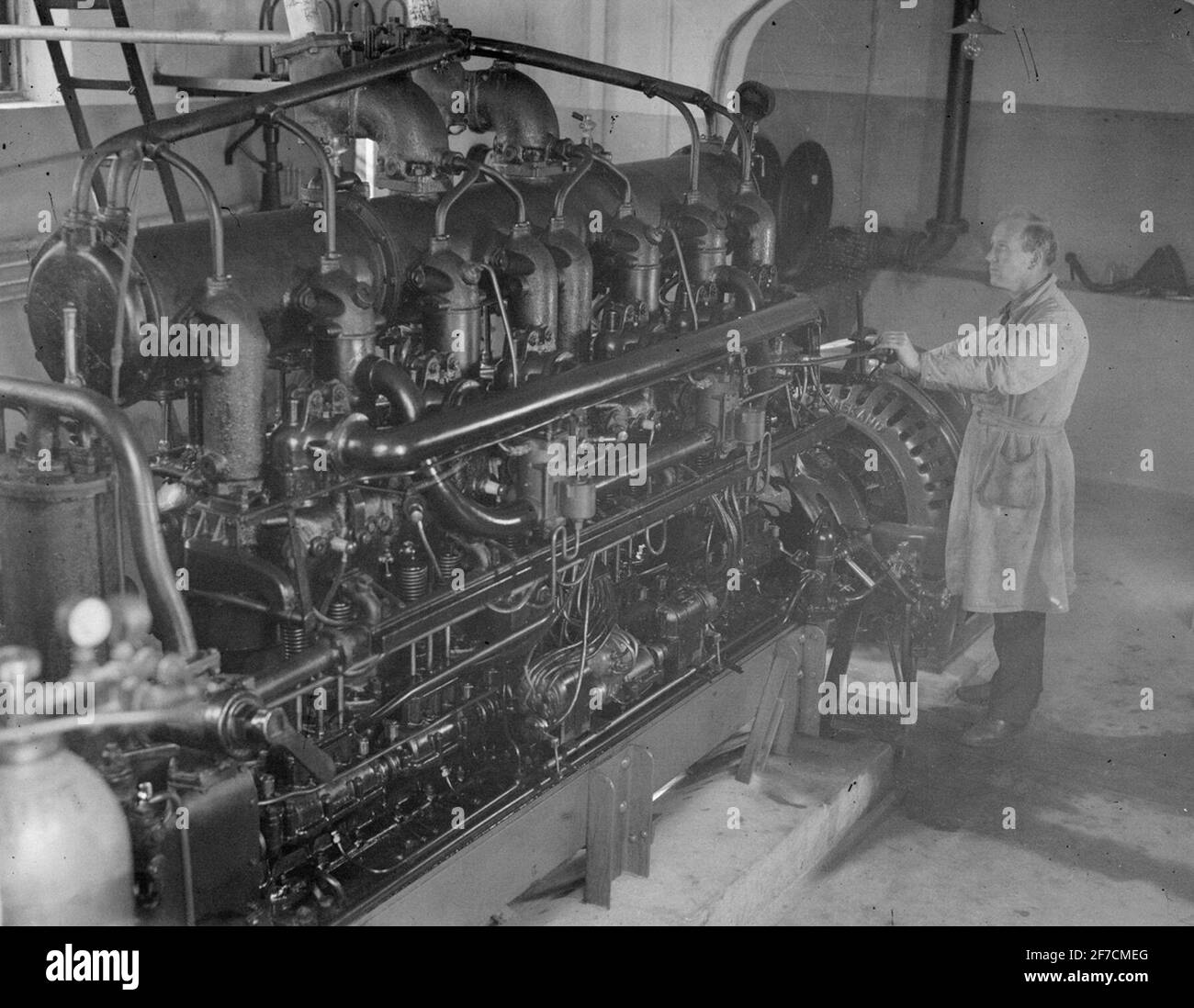 Power units on the CVM motif: A man maneuvering a power supply in the ...