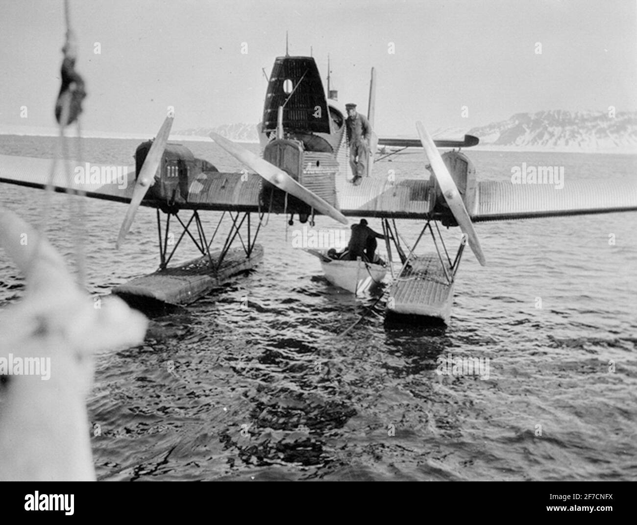 Man on boat floating Black and White Stock Photos & Images - Alamy