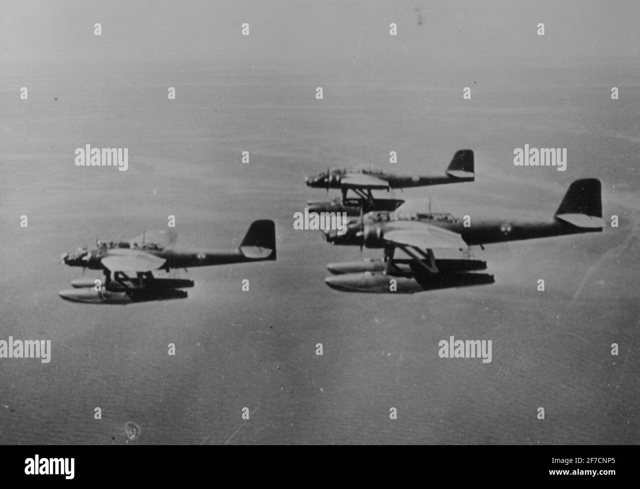 Three aircraft t 2 fly over field . Three aircraft t 2 fly over fields ...