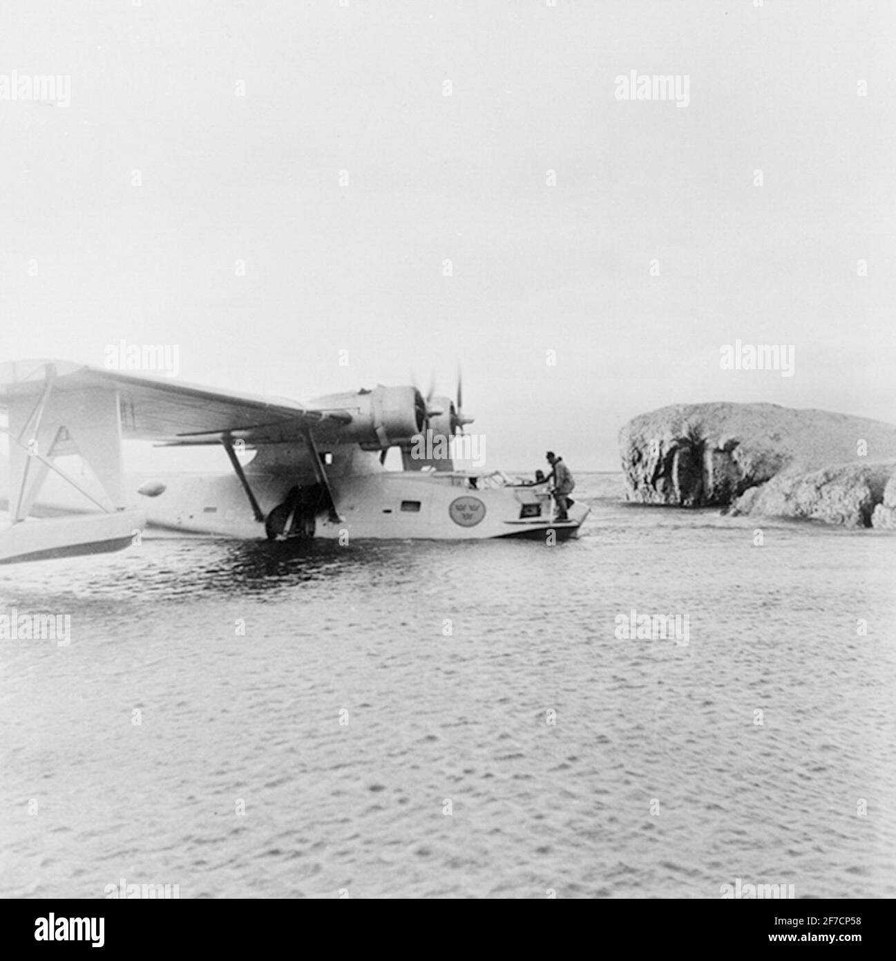 Aircraft TP 47, Catalina in the water on the tip mountains under Sepit ...