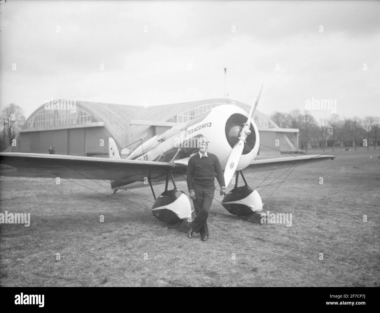 Portrait with Texaco No 13 aircraft Texaco No 13 with pilot on the ore ...