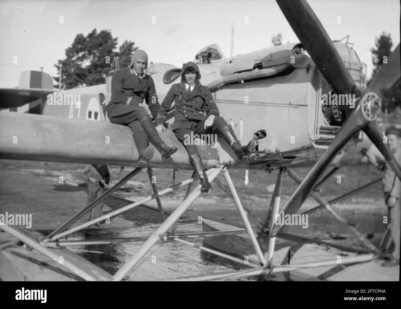 Aircraft Heinkel HE 4 Two Flyers from the Air Force Sitting on the wing ...