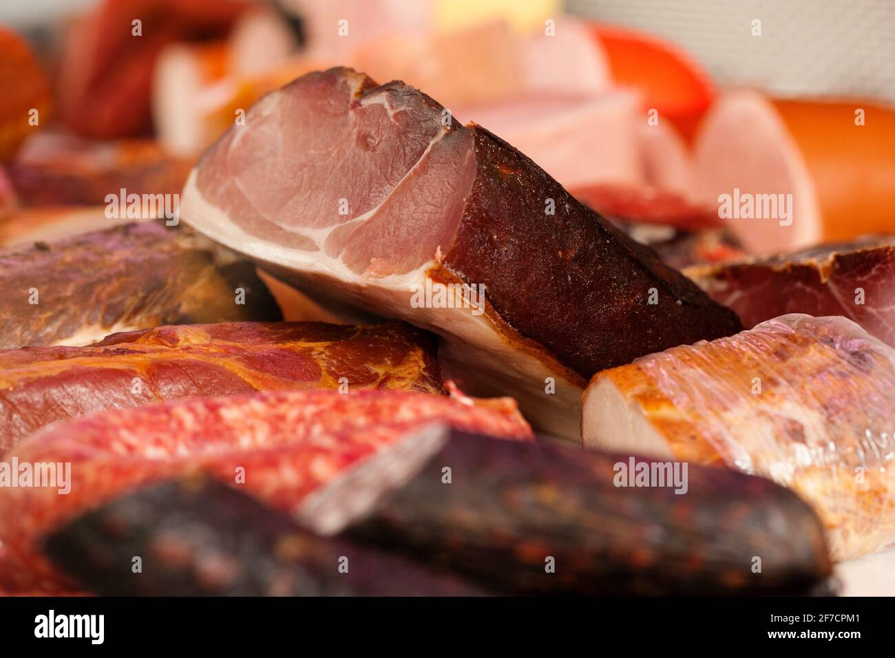 Display in a butcher?s shop - variety of bacon Stock Photo - Alamy
