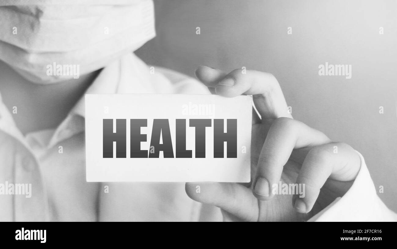 Health word card in hands of Medical Doctor Stock Photo - Alamy