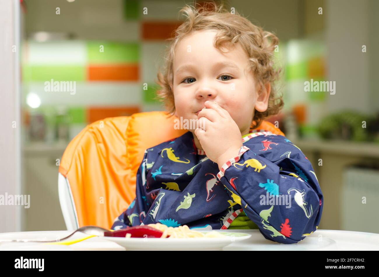 little child eating at home Stock Photo - Alamy