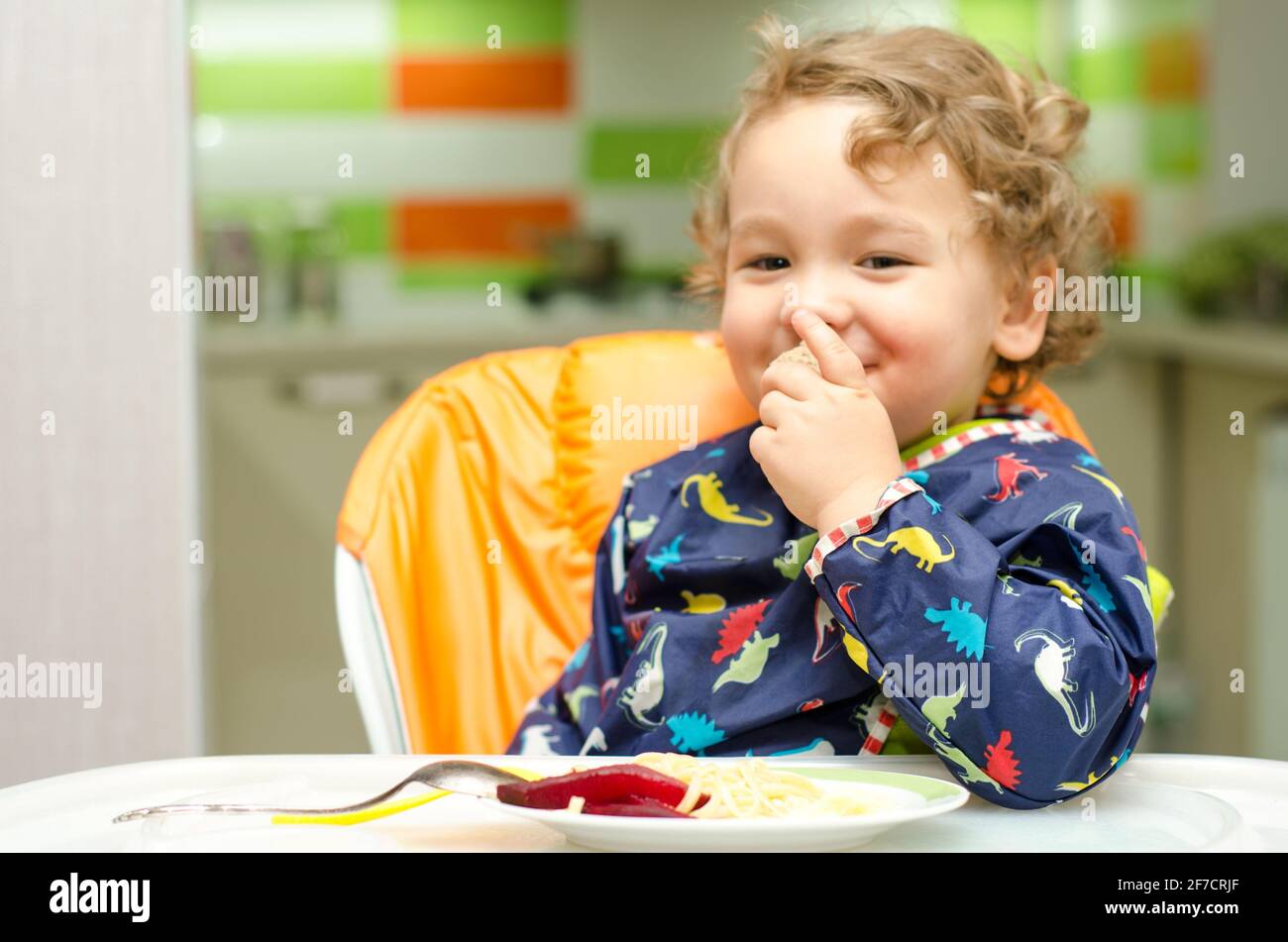 little child eating at home Stock Photo - Alamy