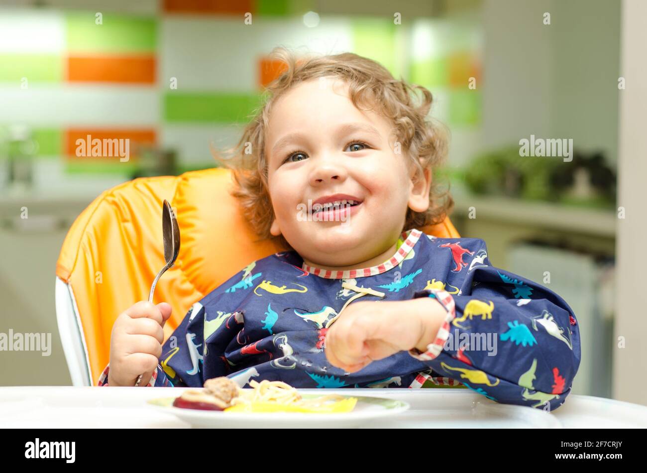 little child eating at home Stock Photo - Alamy