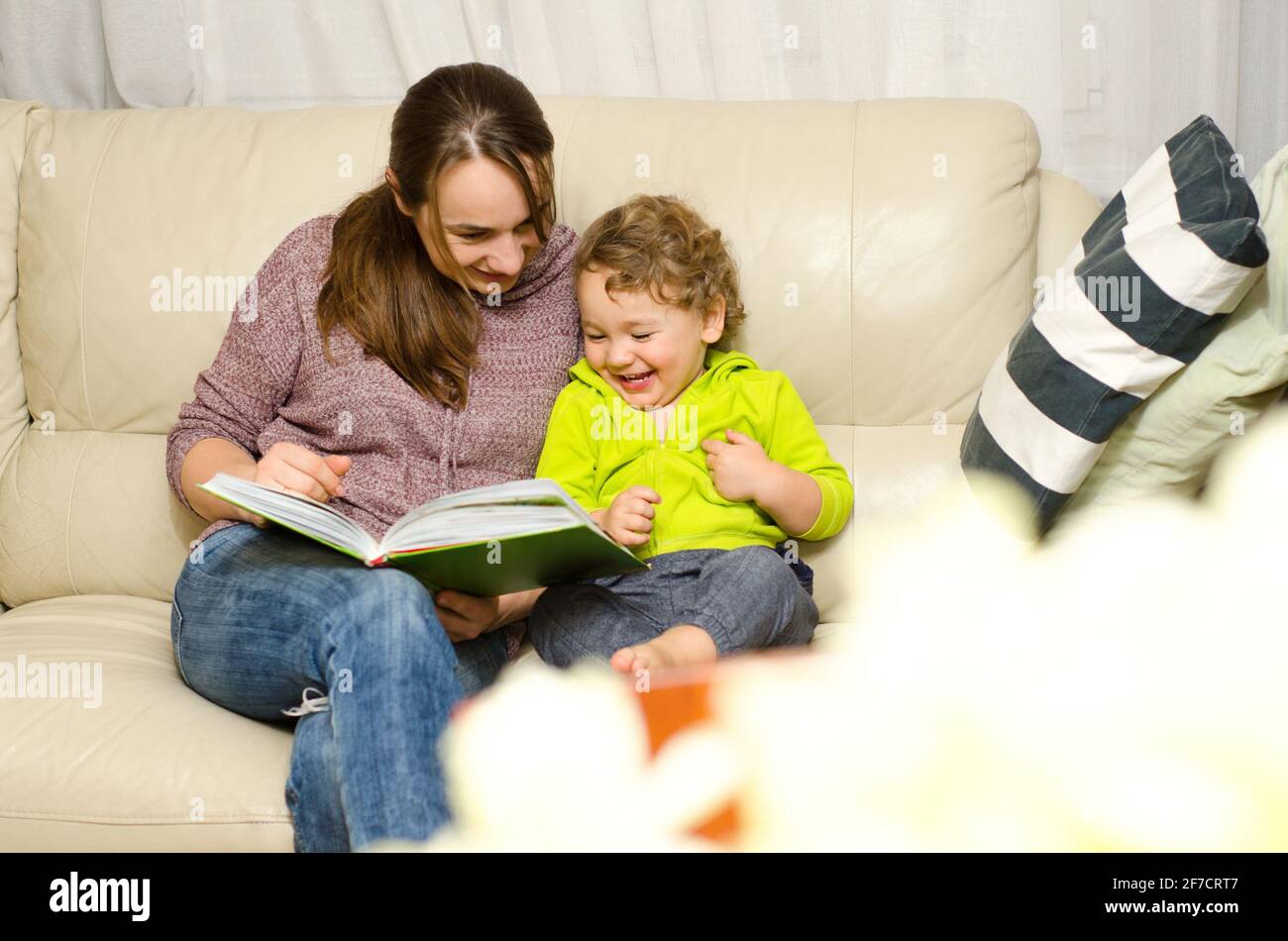 mother and child reading book at home Stock Photo - Alamy
