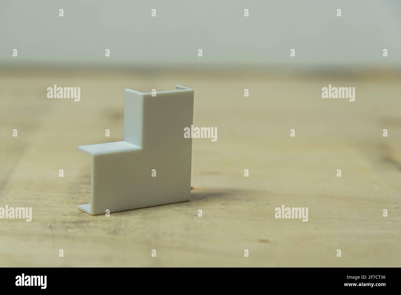 Electrical connector type elbow 90 degrees on wooden background ...