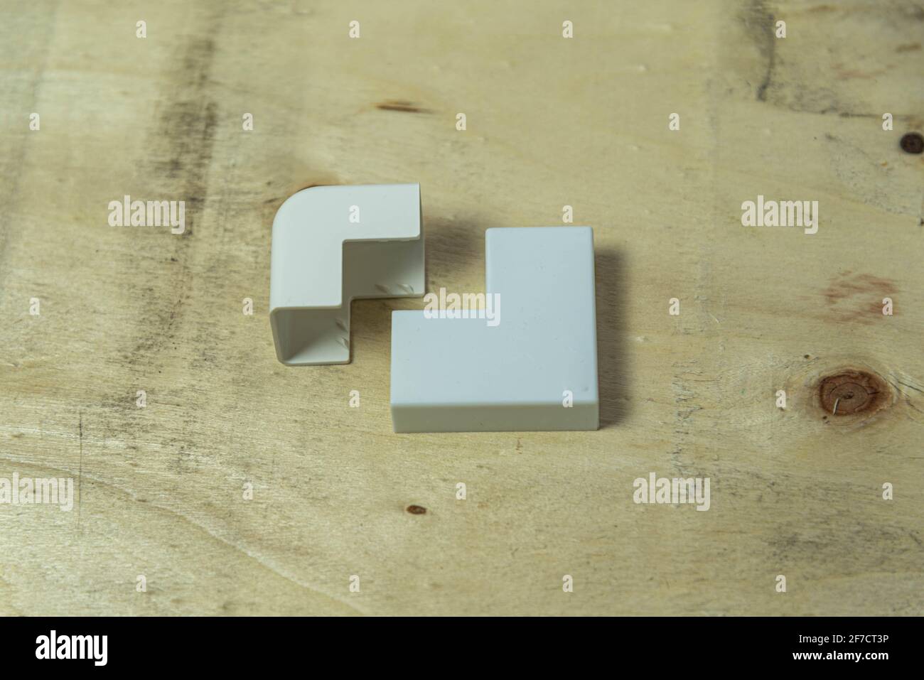 Electrical connector type elbow 90 degrees on wooden background ...