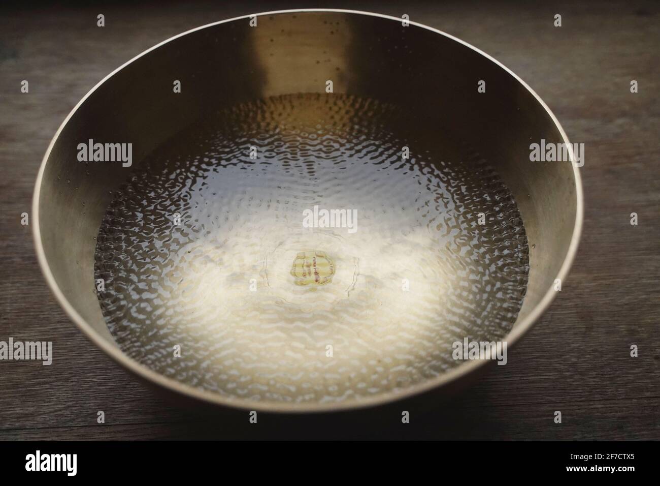 Singing bowl filled with water Stock Photo - Alamy