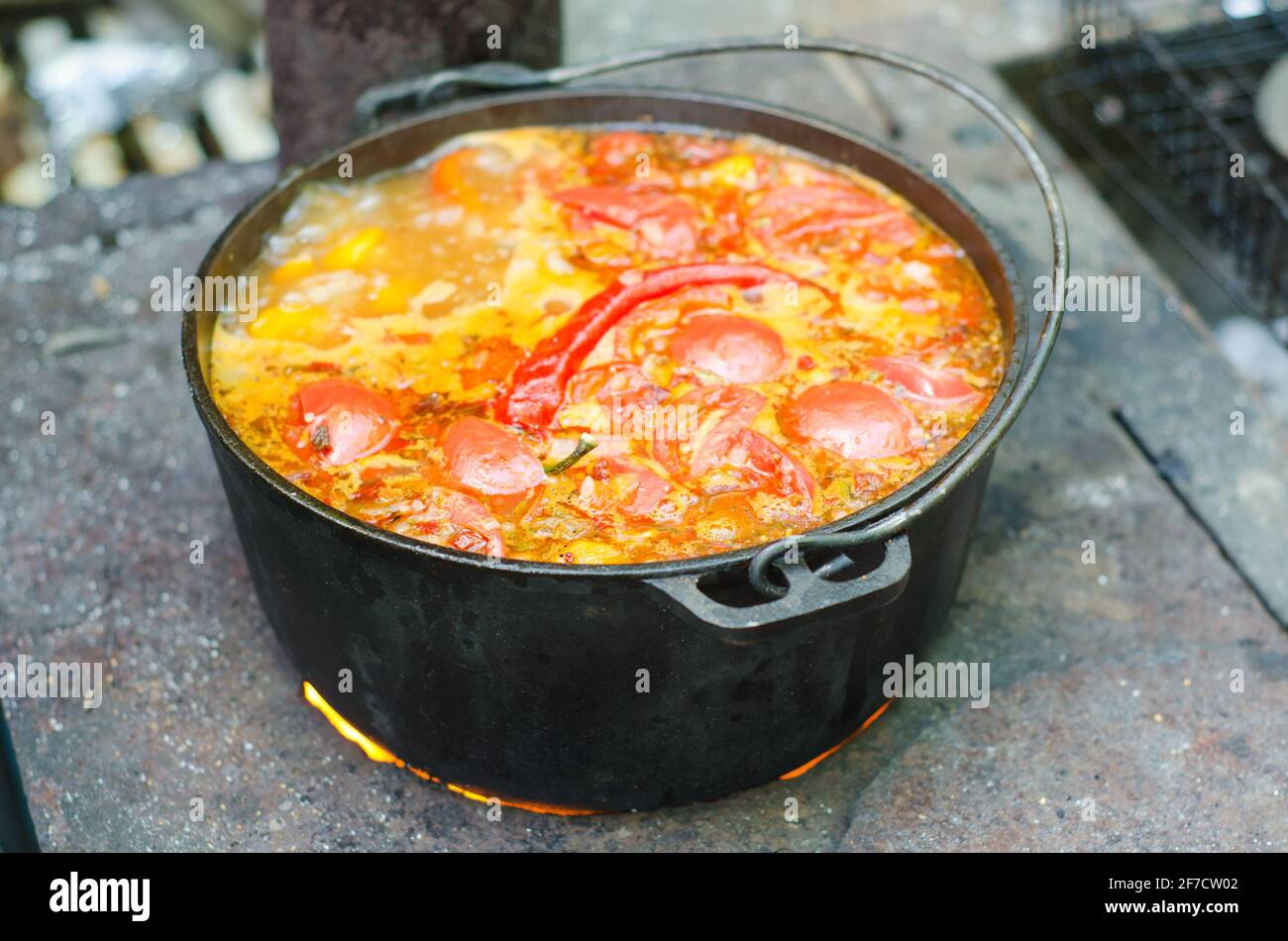 traditional soup cooking in cauldron Stock Photo - Alamy