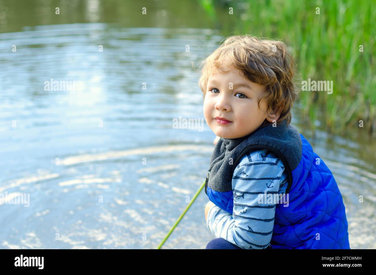 little boy fishing on the lake Stock Photo - Alamy
