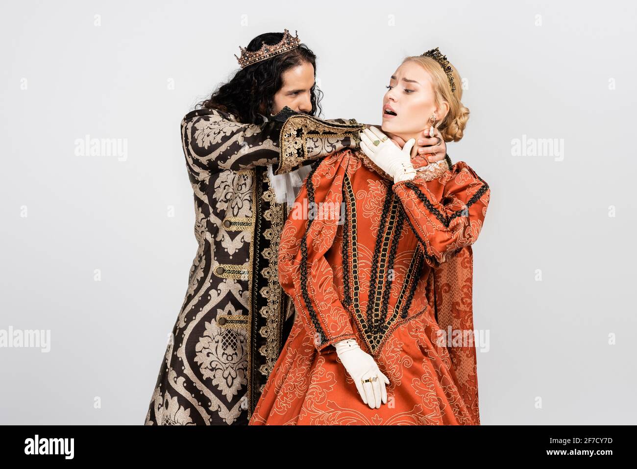 hispanic king in medieval clothing choking shocked queen in golden ...