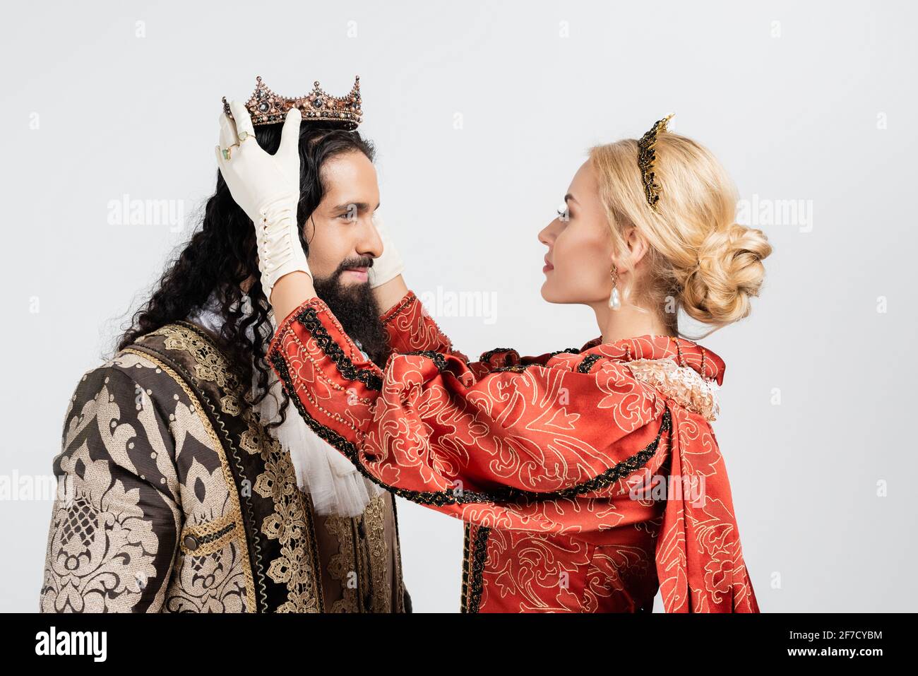 blonde queen wearing crown on hispanic king in medieval clothing ...