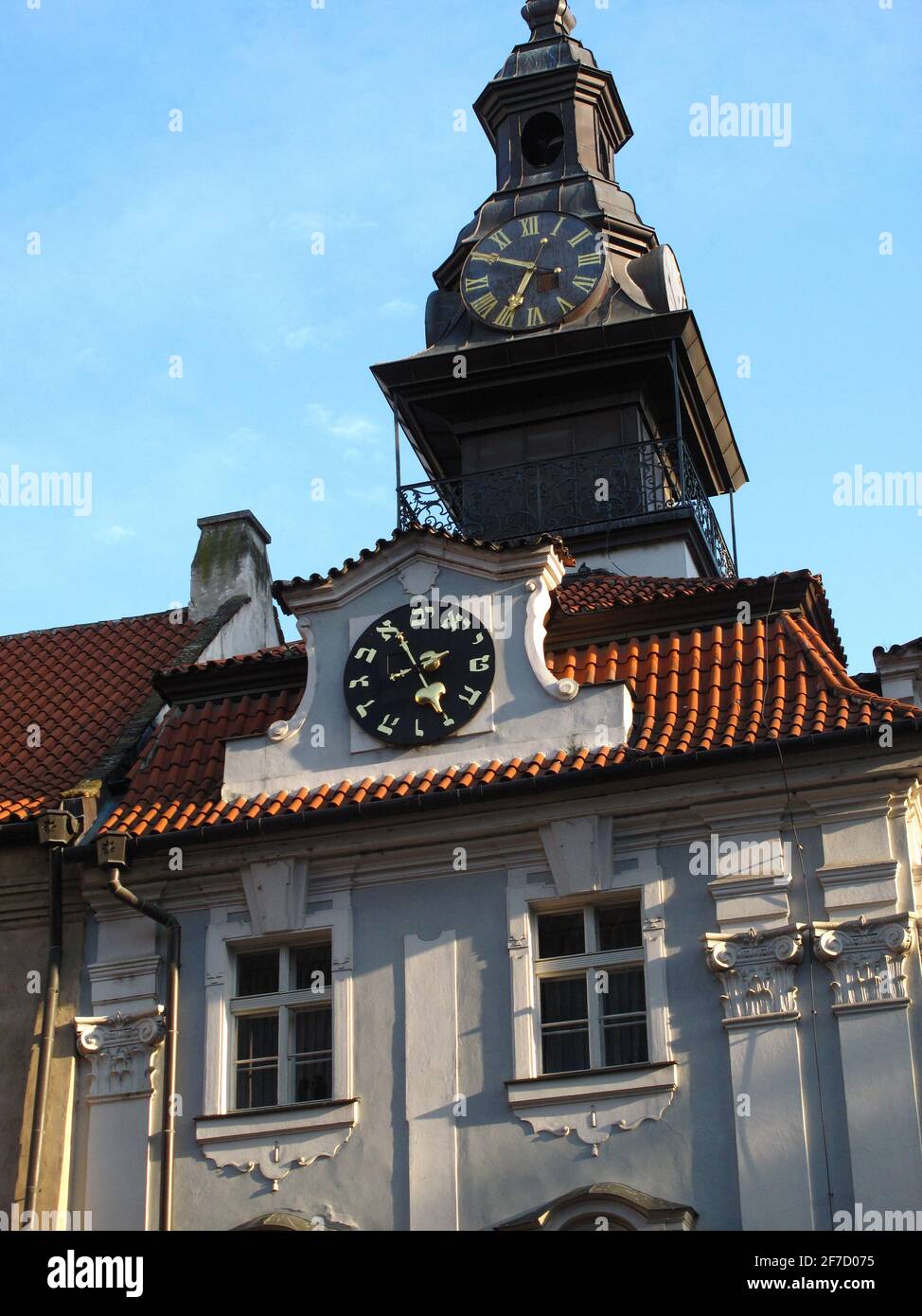 The Jewish Town Hall with two clock faces, one on a tower with roman ...