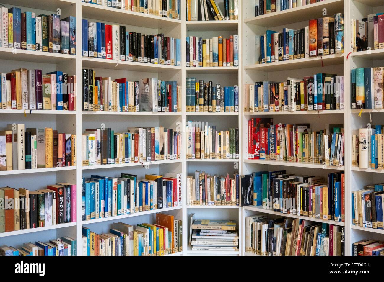 in a library there are many books on the shelves Stock Photo - Alamy