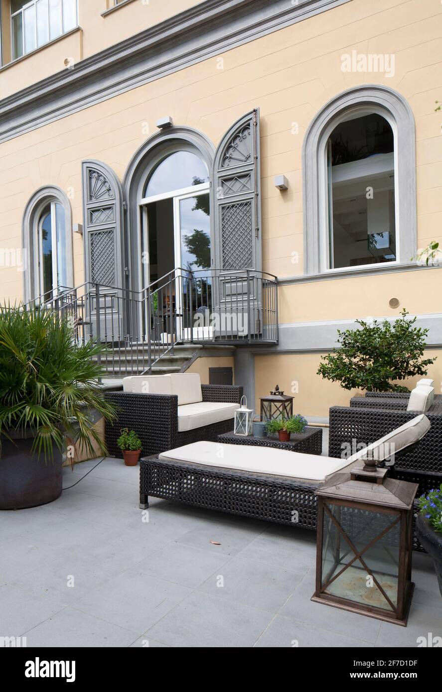 Elegant entrance in a beautiful villa in Milan with some plants and ...