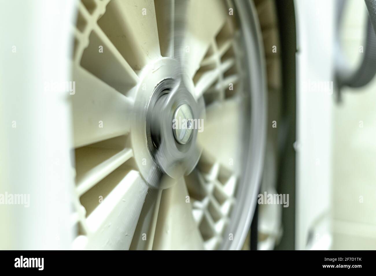 The pulley of the washing machine on the drum at high speeds during ...