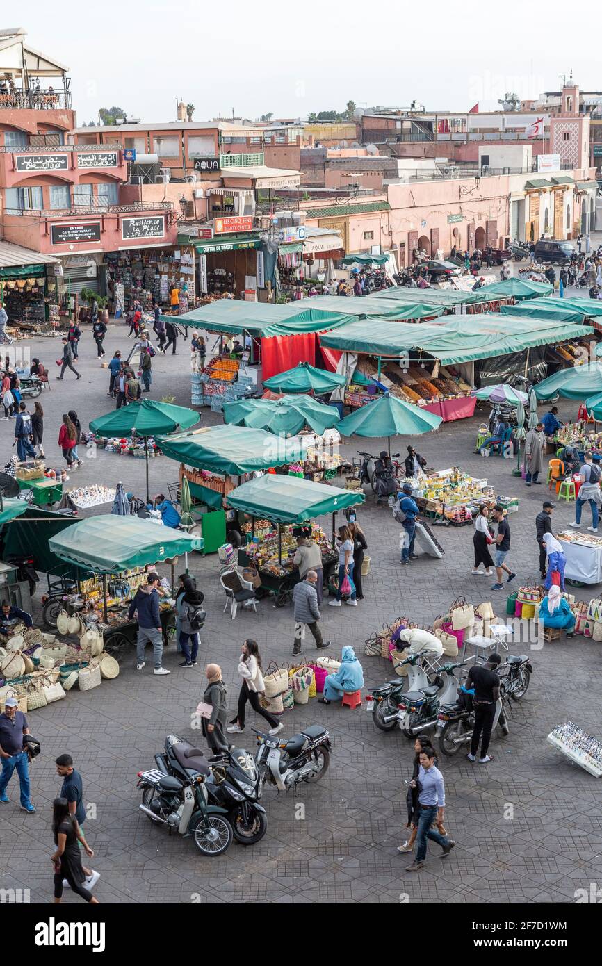 Market stands with green roofs and hustle and bustle at the famous ...
