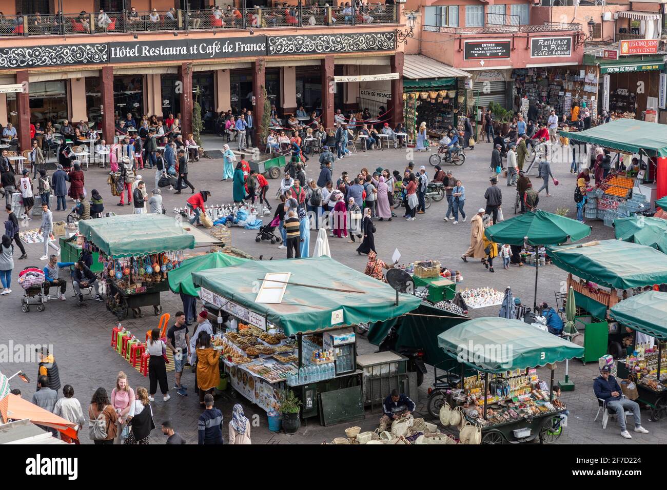 Market stands with green roofs and hustle and bustle at the famous ...