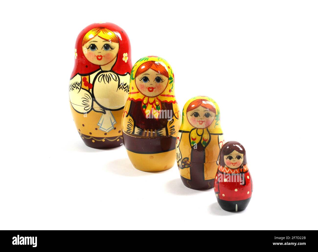 A Collection of Wooden Nesting Stacking Dolls on White Background Stock ...