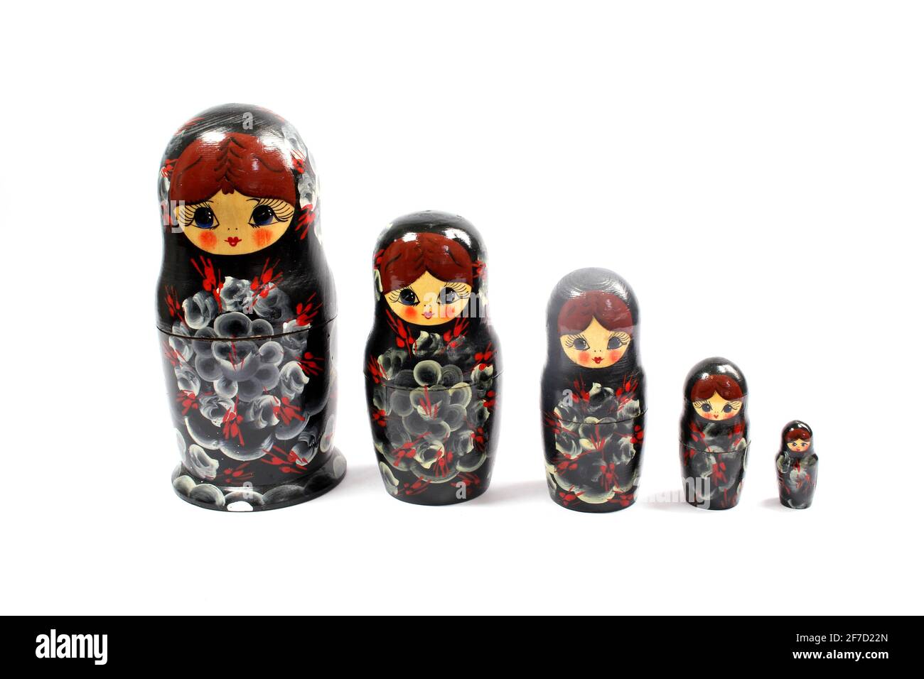 A Collection of Wooden Nesting Stacking Dolls on White Background Stock ...