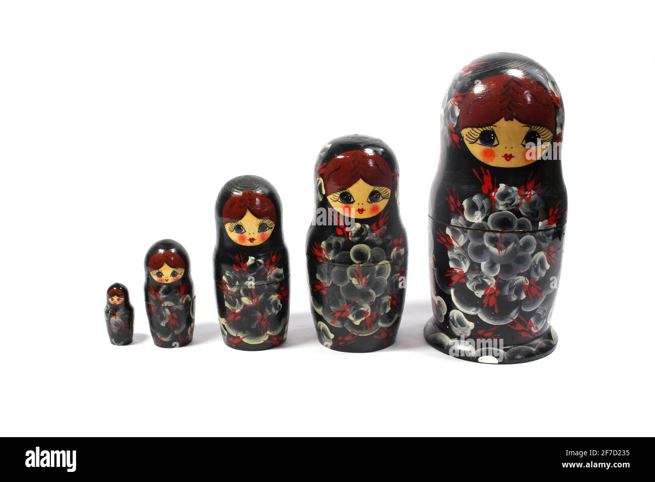 A Collection of Wooden Nesting Stacking Dolls on White Background Stock ...