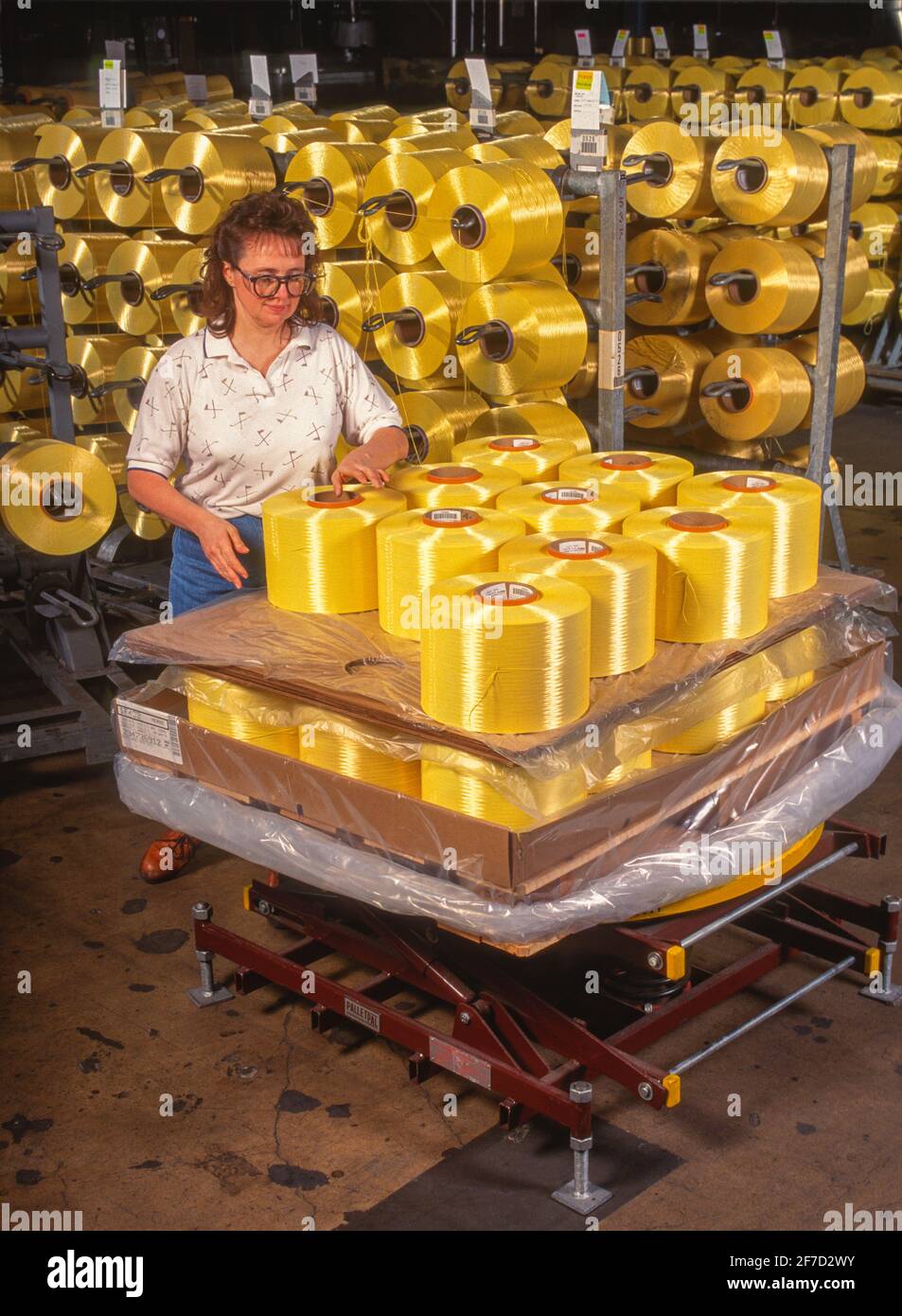 RICHMOND, VIRGINIA, USA, APRIL 16, 1998 - Woman packing spools of ...